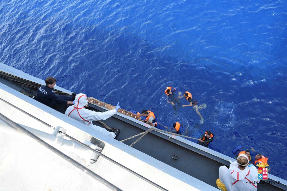 Desperate Migrants Pictured Clinging To Sinking Boat In The ...