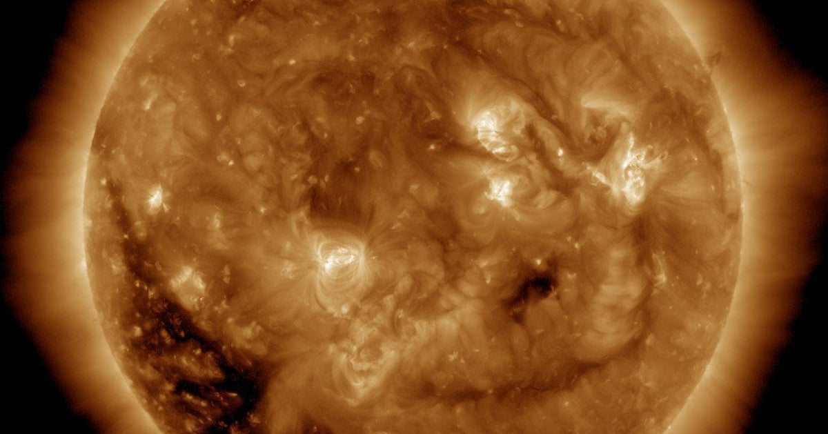 NASA Reveals Striking Photo Of The Sun Smiling Into Space | HuffPost UK ...
