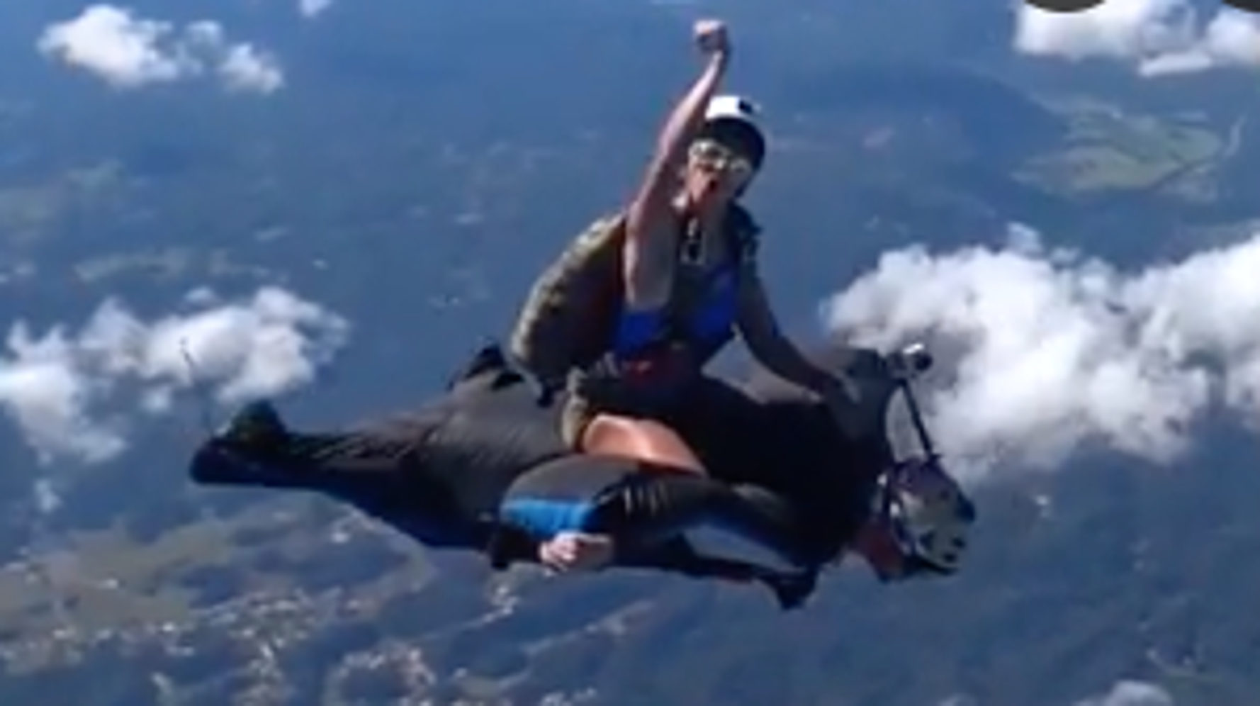 Watch A Skydiver Ride A Wingsuit Flyer Like It's A Rodeo In The Clouds ...
