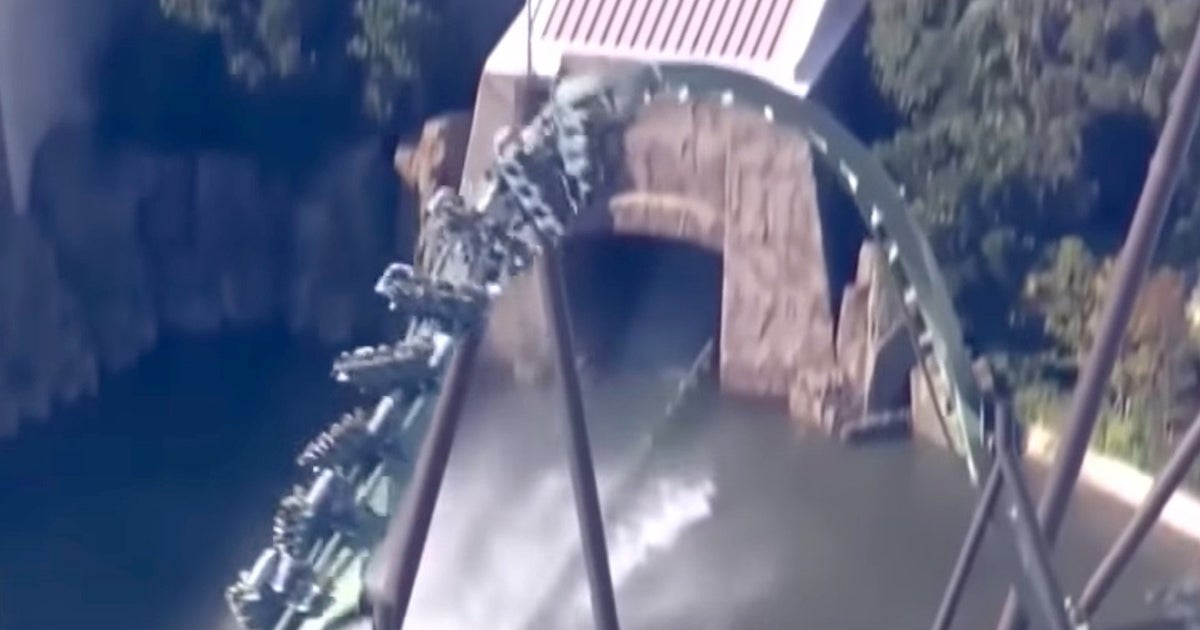 Roller Coaster Riders Suspended 100 Feet In The Air, Facing Down, After ...