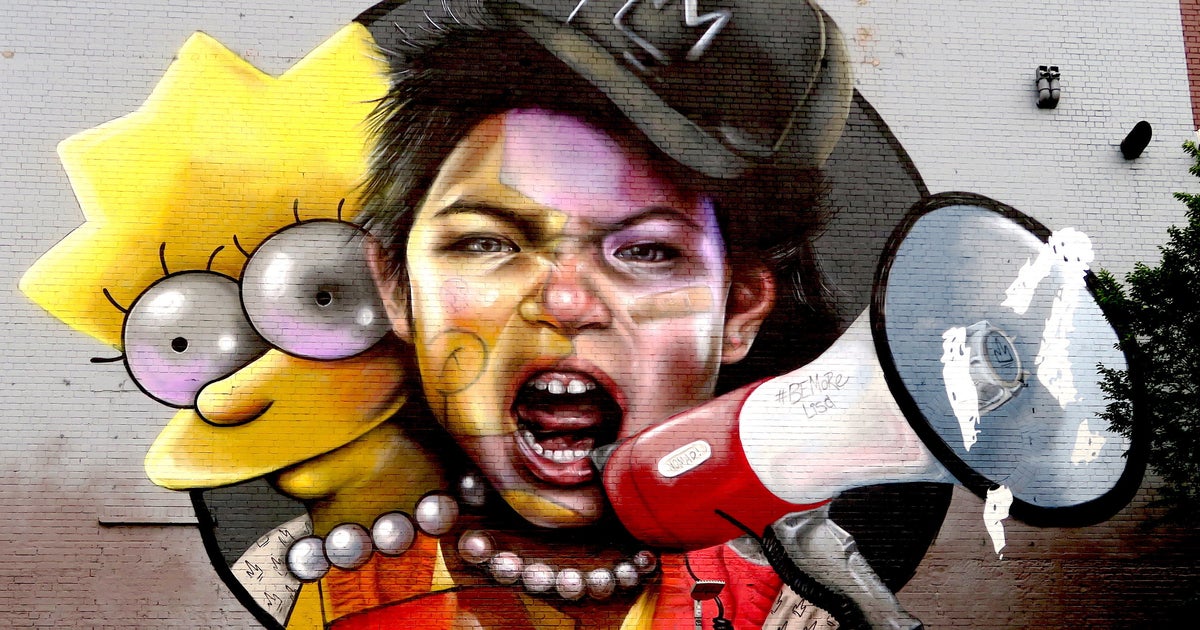 Street Art Of Lisa Simpson And Women's Rights Take Center Stage At ...
