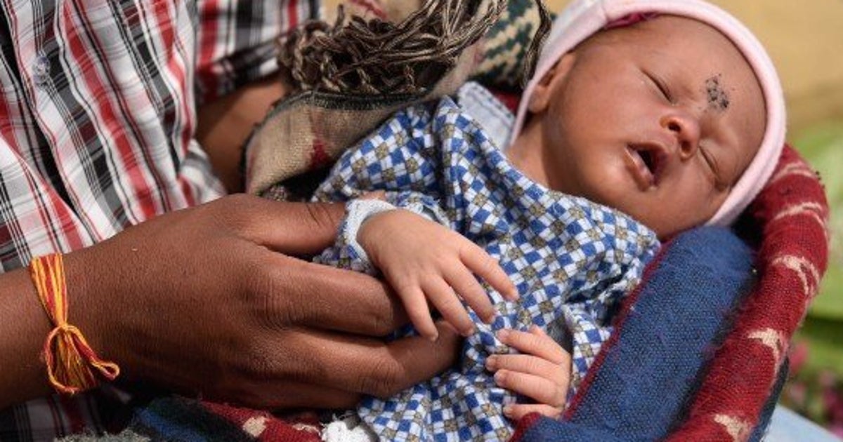 Baby Survives After Falling Off The Arms Of Dozing Parents In Crowded ...