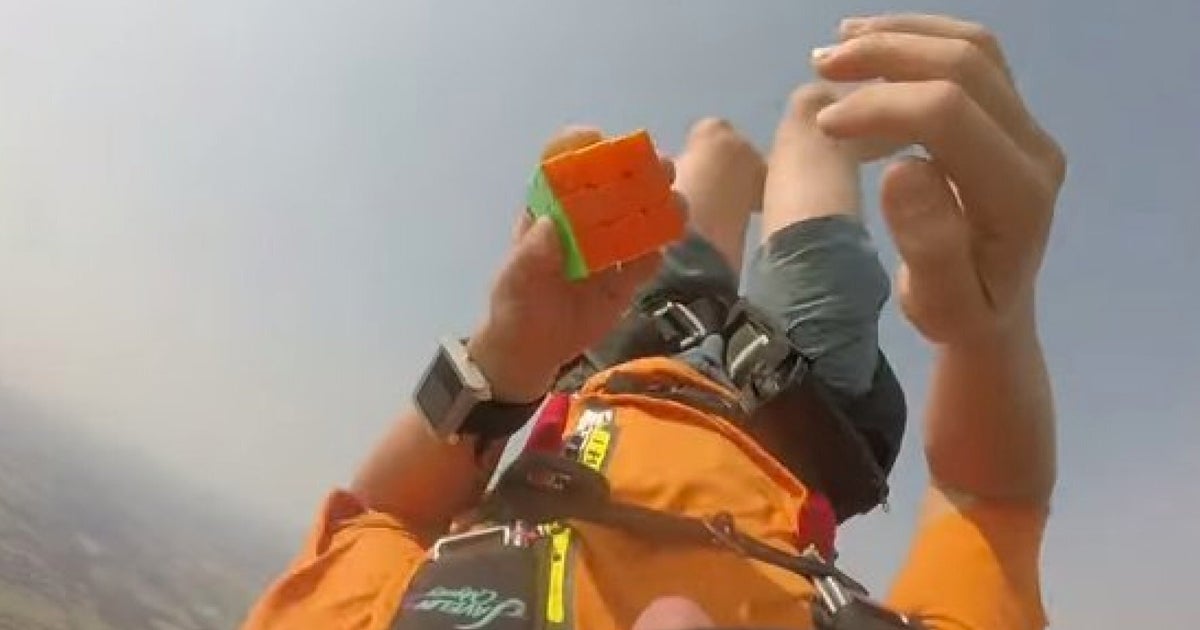 Watch This Guy Solve The Rubik's Cube While Free-Falling During A ...