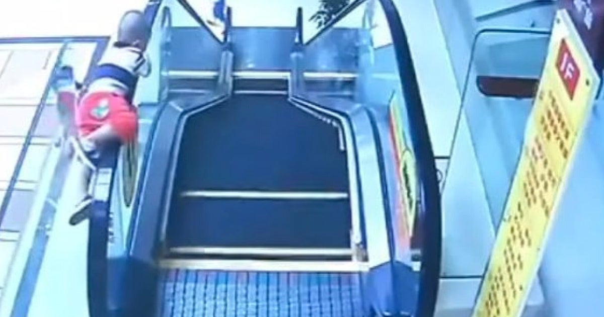 Two-Year-Old Boy Survives Dramatic Fall From Escalator Handrail ...