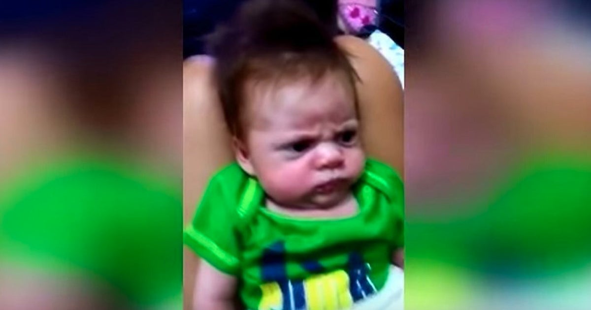 Angry Baby Refuses To Smile Despite Parents Numerous Attempts To Cheer ...