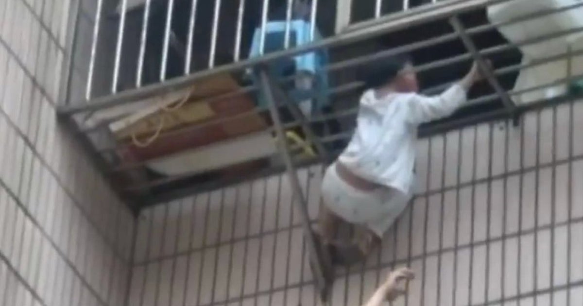 Chinese Girl Rescued After Getting Head Stuck In Window Security Bars