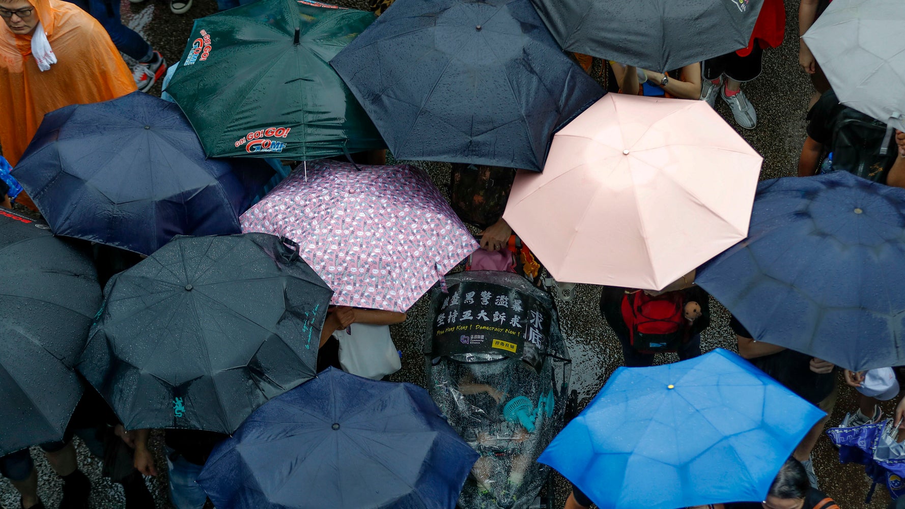 Tens Of Thousands Of Hong Kong Protesters March Through Heavy Rain ...