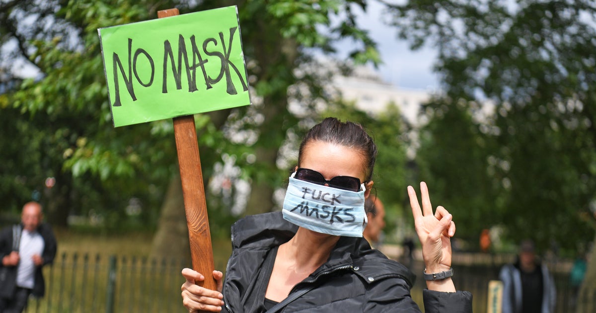 People Are Protesting Against Wearing Masks While... Wearing Masks ...