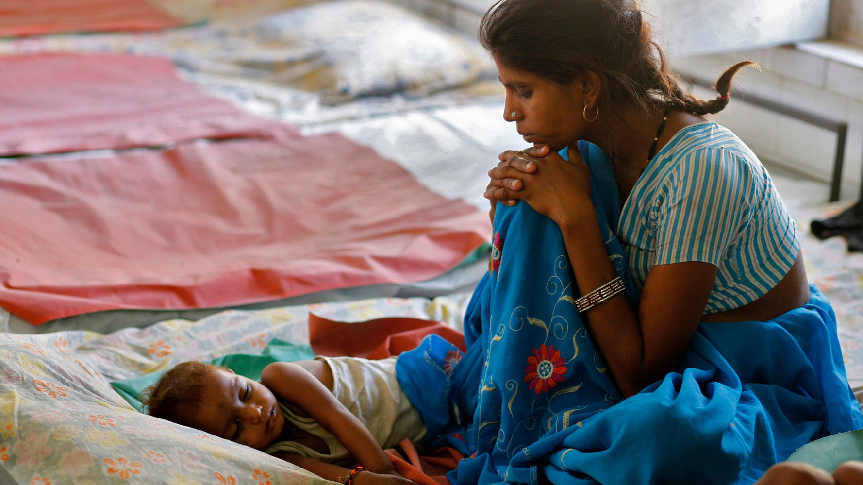 Poor Indian Mother With Baby