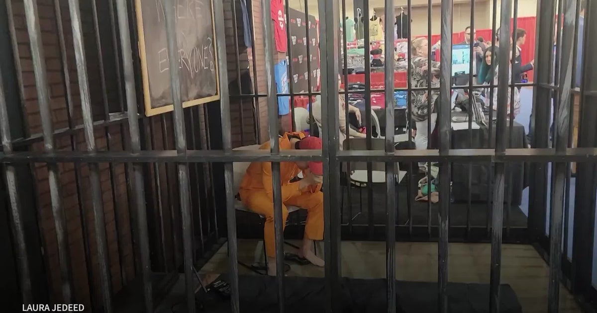 CPAC Booth Features Jan.6 Rioter Crying In A Cell | HuffPost Videos
